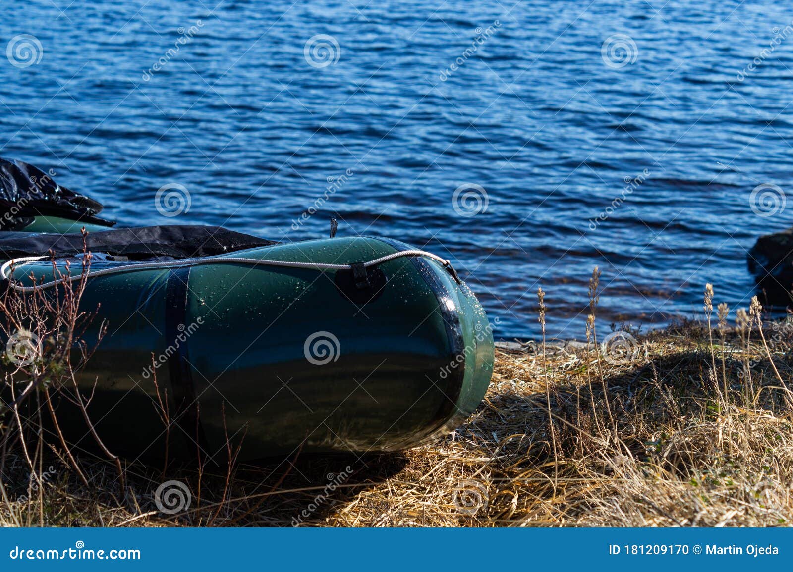Pack Raft Besides a Lake in Grass Stock Photo - Image of awesome ...