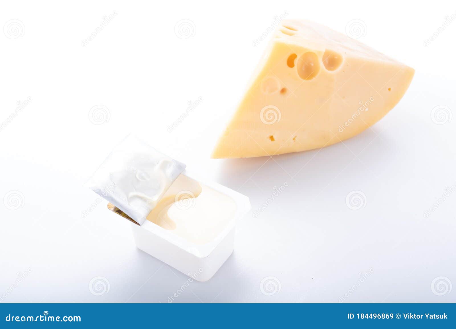 A Package of Cheese Sauce and a Piece of Hard Cheese. Cheese Seasoning ...