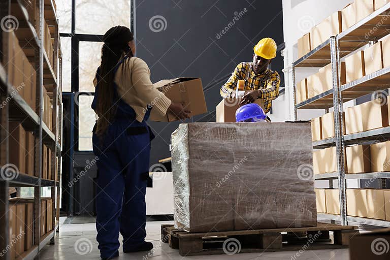 Package Handler Bringing Parcels To Warehouse Worker for Packing Stock Image - Image of ...