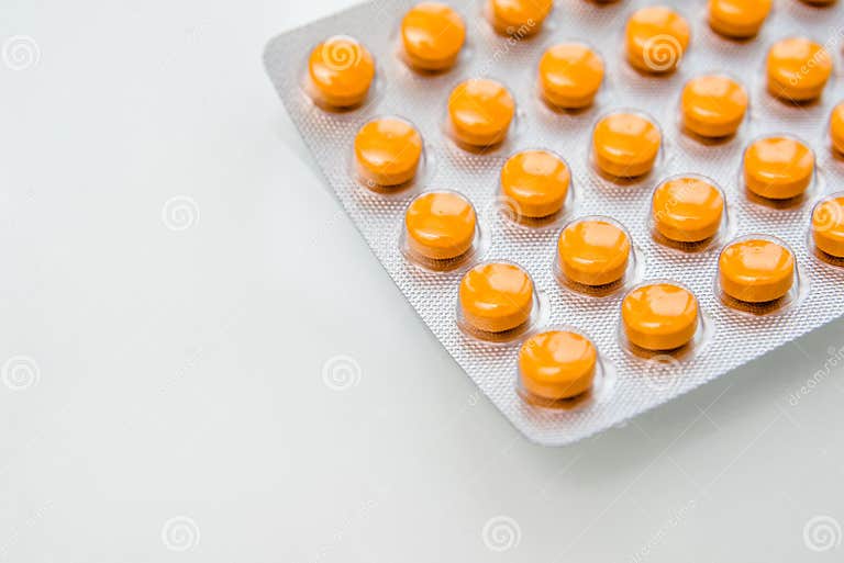 A Package of Orange Tablets Stock Photo - Image of pack, drugs: 191527756
