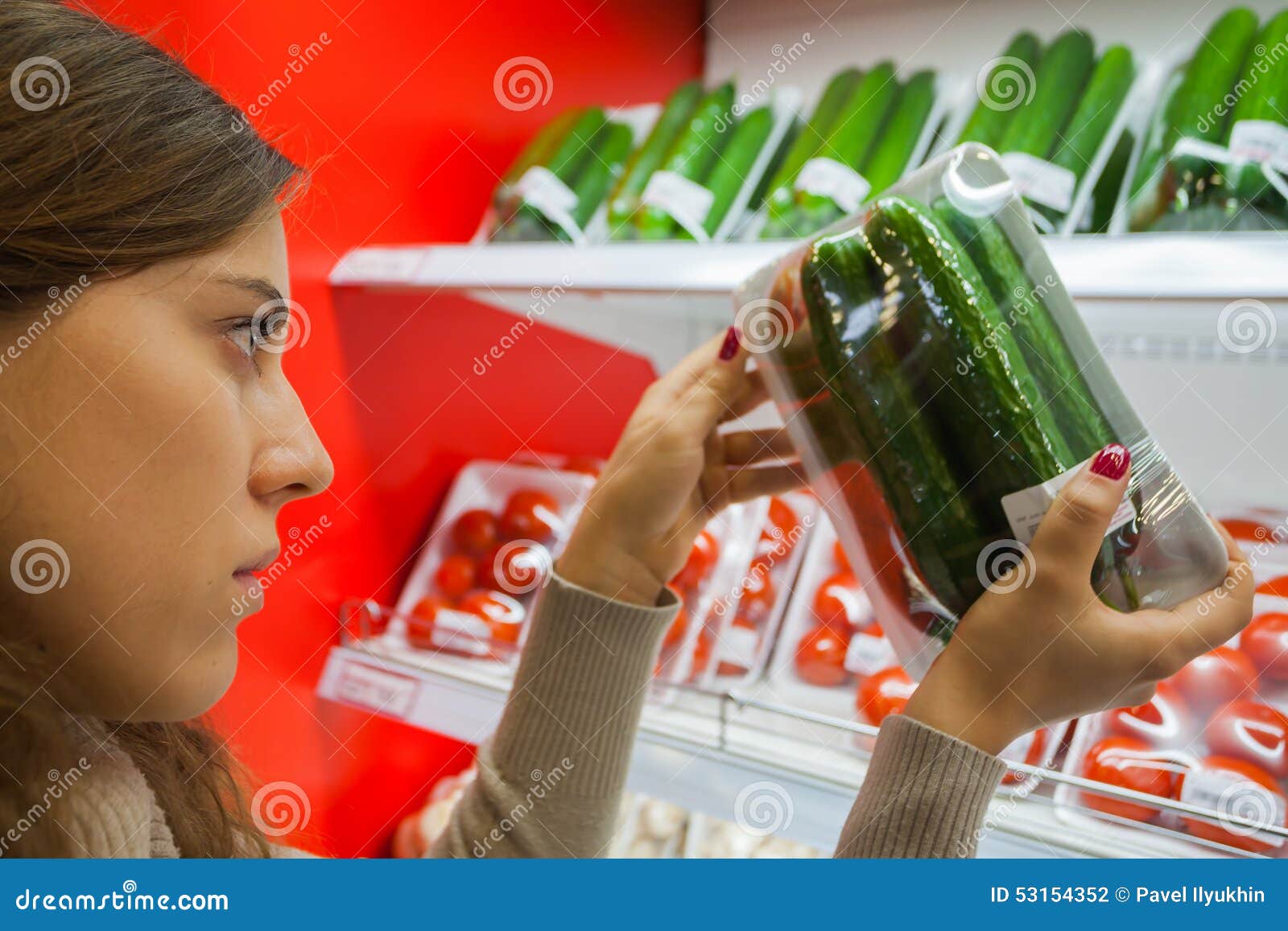 Packaged Cucumber with Woman Hand in the Supermarket Stock Photo ...
