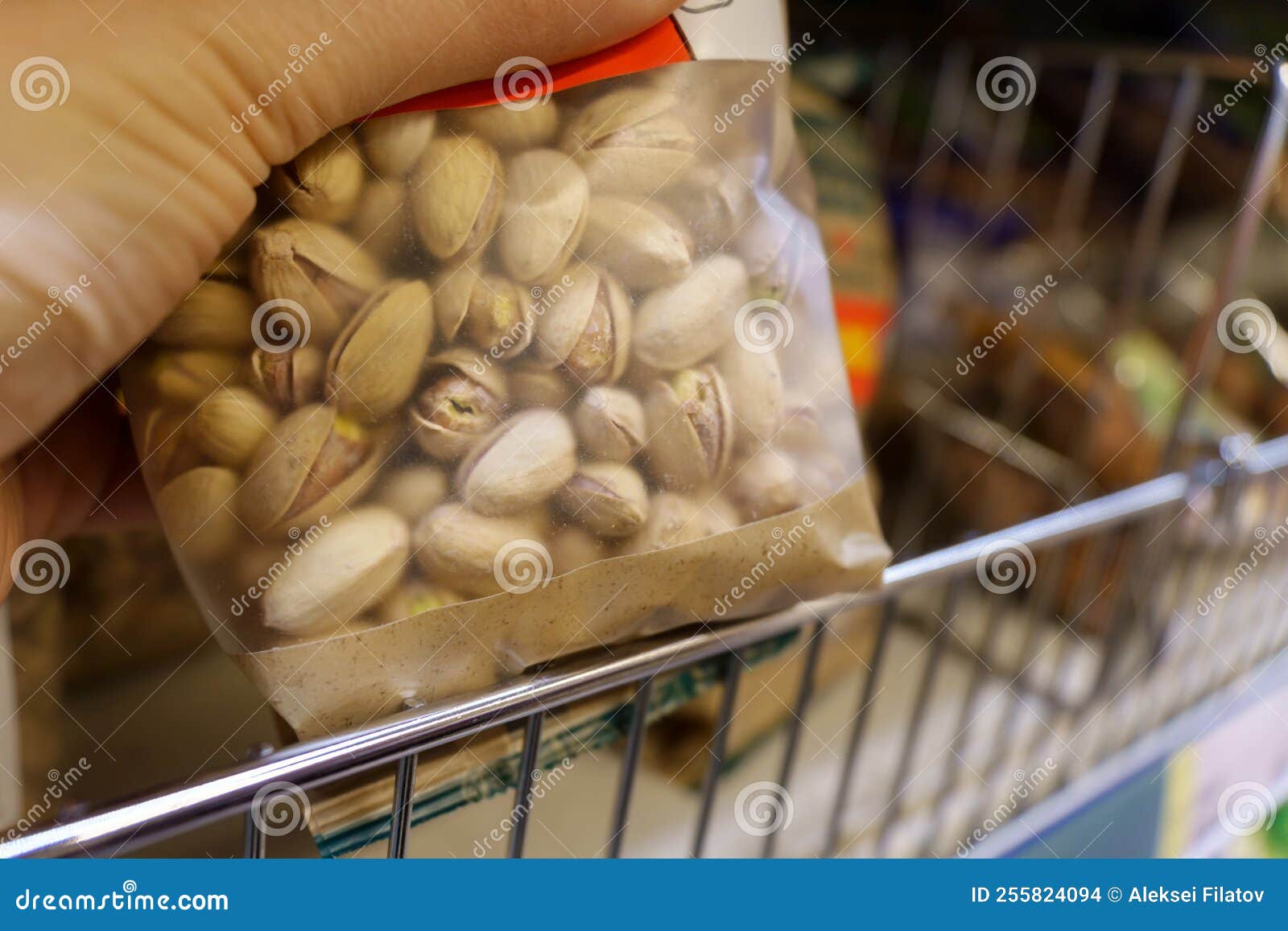 Packaged Snacks Pistachios Nuts on the Shelves of the Hypermarket. a ...
