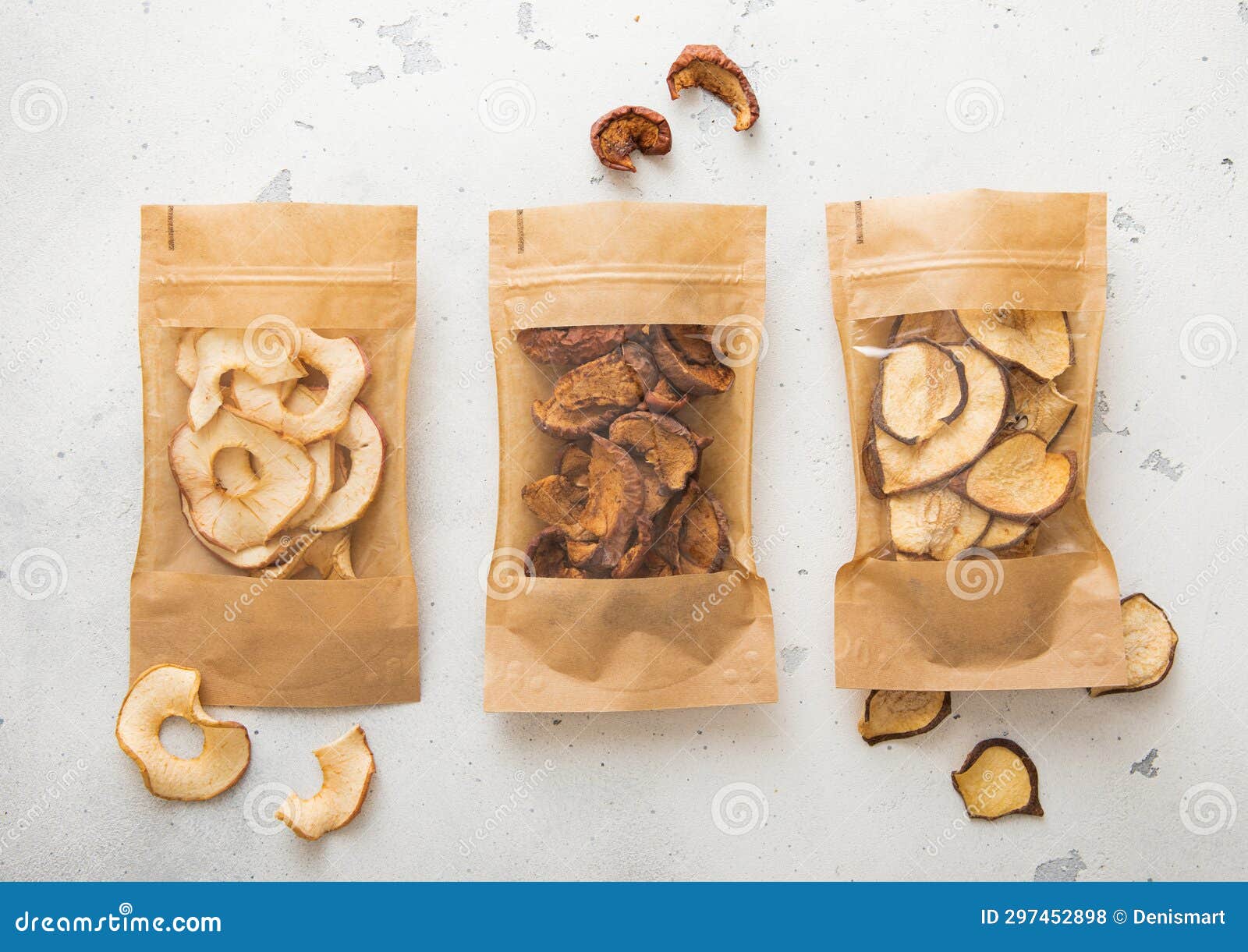 Packages of Assorted Sweet Dried Apple Chips and Slices on Light ...