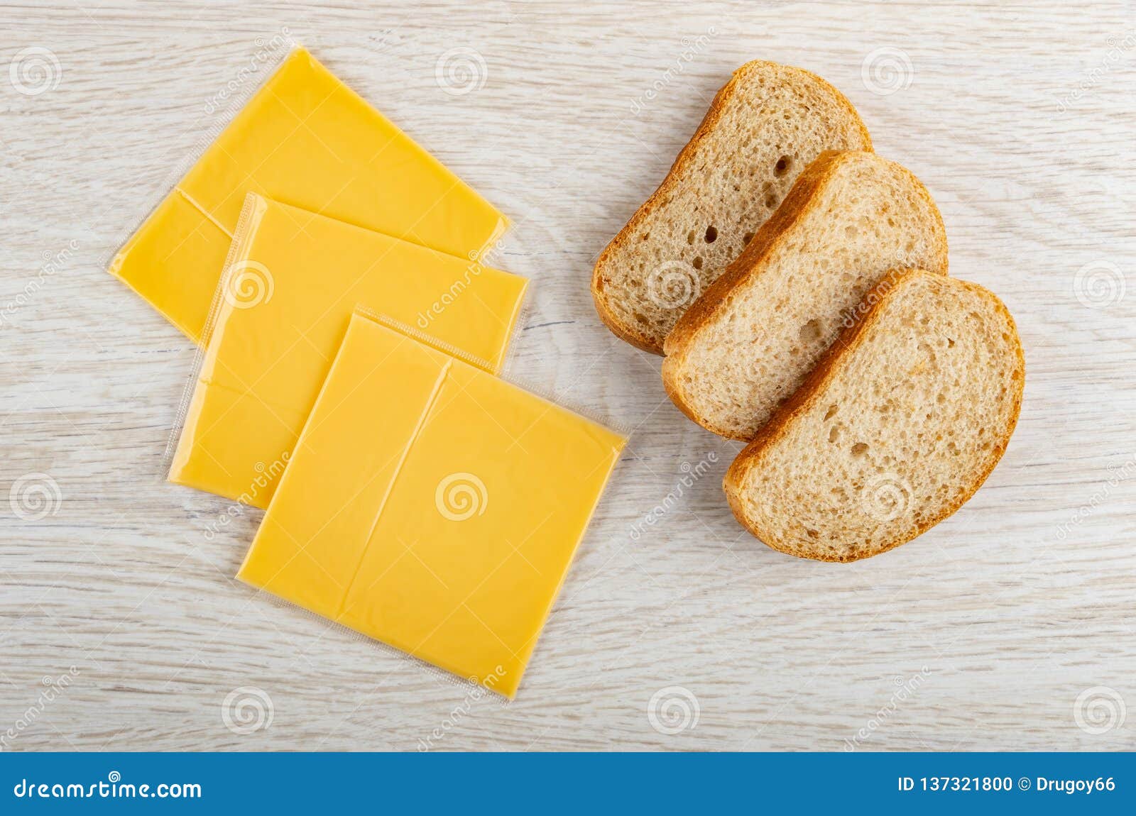 Packages of Cheese, Pieces of Bread on Table. Top View Stock Photo ...