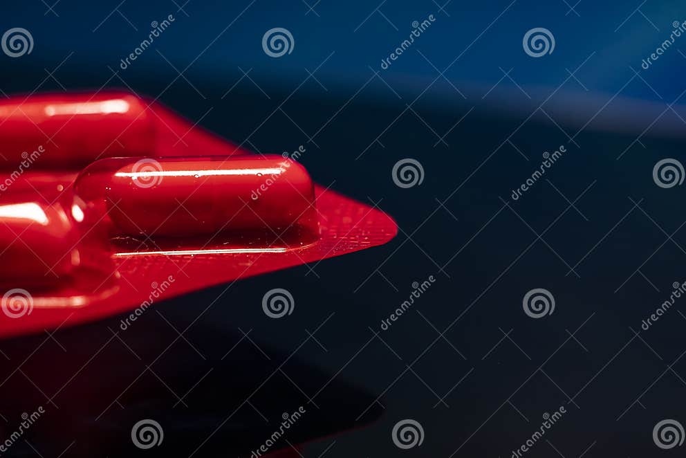 Packages of Tablets in a Red Wrapper on a Black Background Stock Photo ...