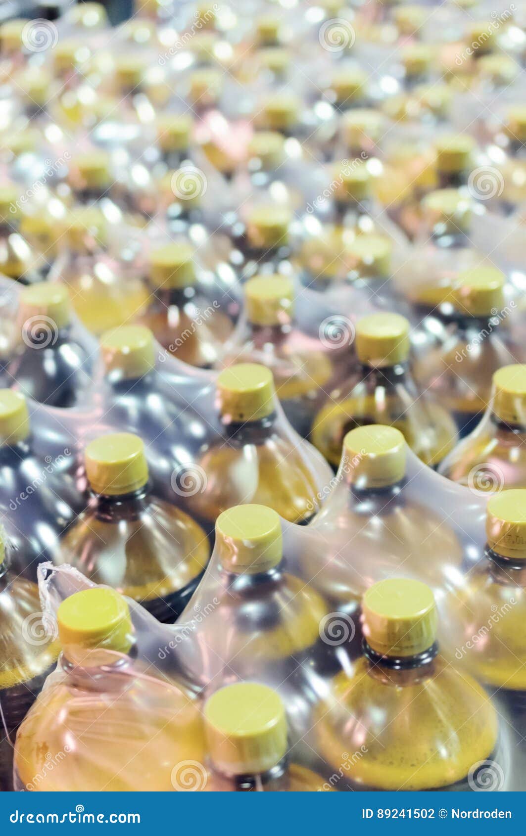 Packaging Many Plastic Bottles at the Brewery. Stock Photo - Image of ...