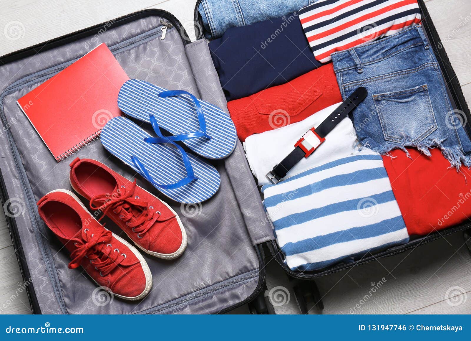 Packed suitcase with stuff stock photo. Image of stuff - 131947746