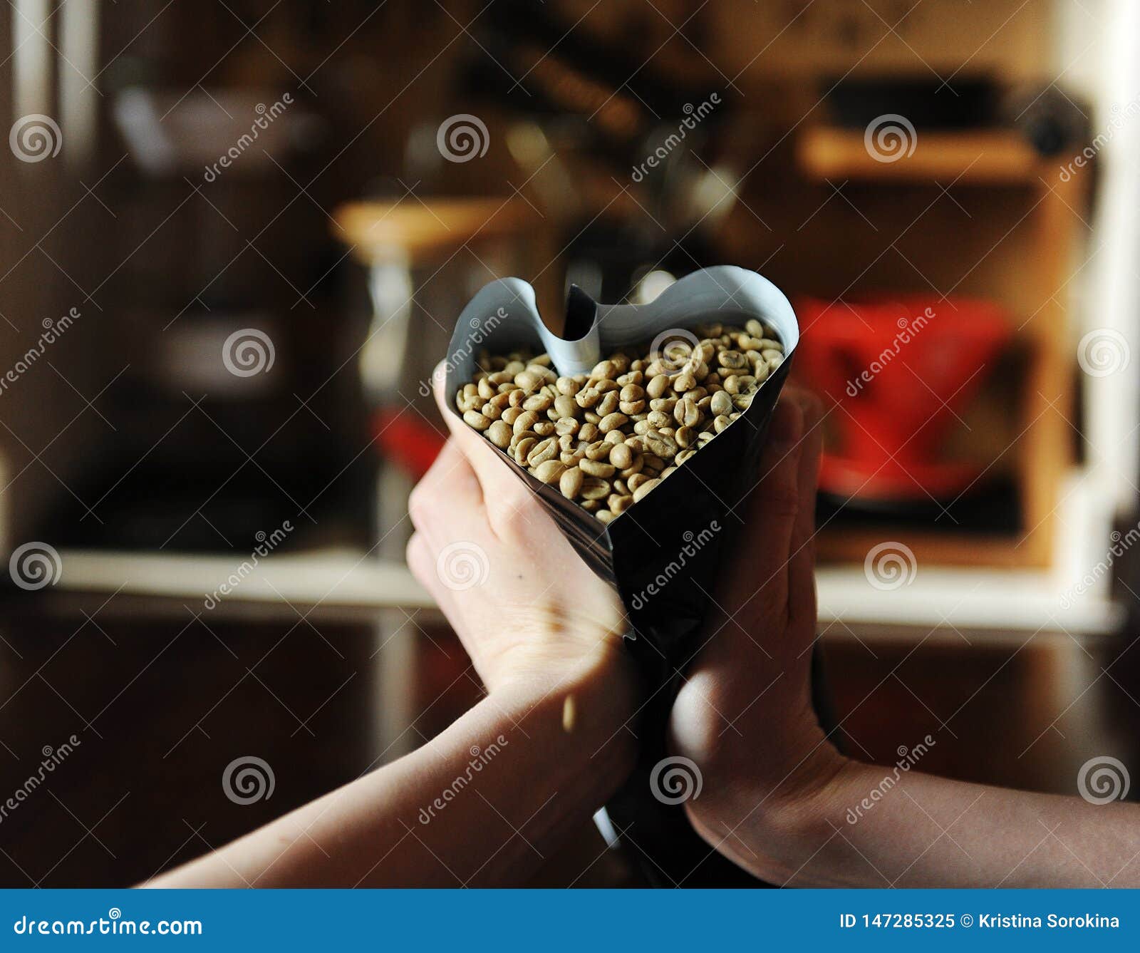 Packet of Green Coffee is Compressed in Shape of Heart in Hands. on the ...
