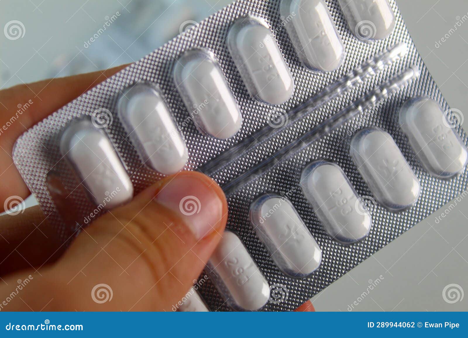 A Packet of Painkiller Tablets in a Plastic Container Stock Photo ...