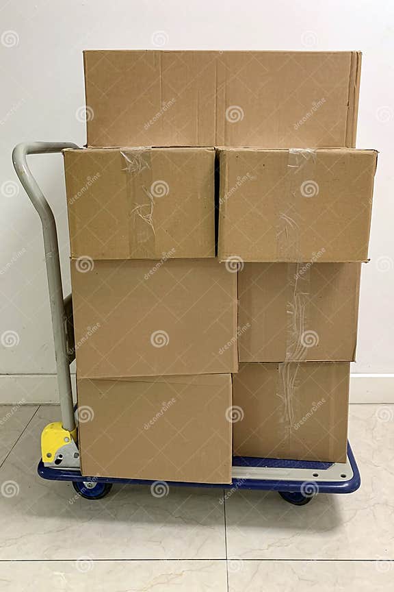 Packing Boxes Stacked on a Trolley Stock Photo - Image of parcel ...