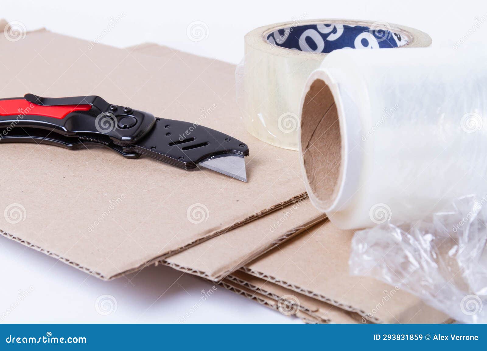 Packing the Goods in a Cardboard Box and Stretch Film. Tools for ...