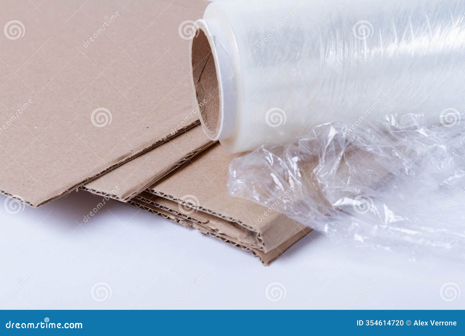 Packing the Goods in a Cardboard Box and Stretch Film. Tools for ...