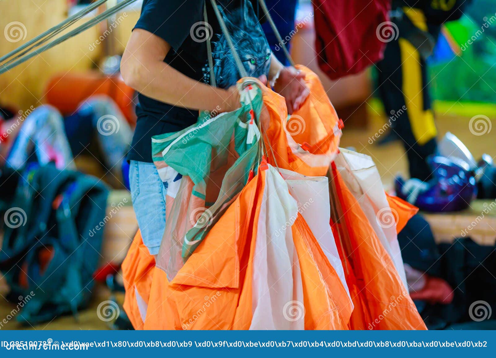 Packing a Parachute into a Backpack. Stock Photo - Image of caucasian ...