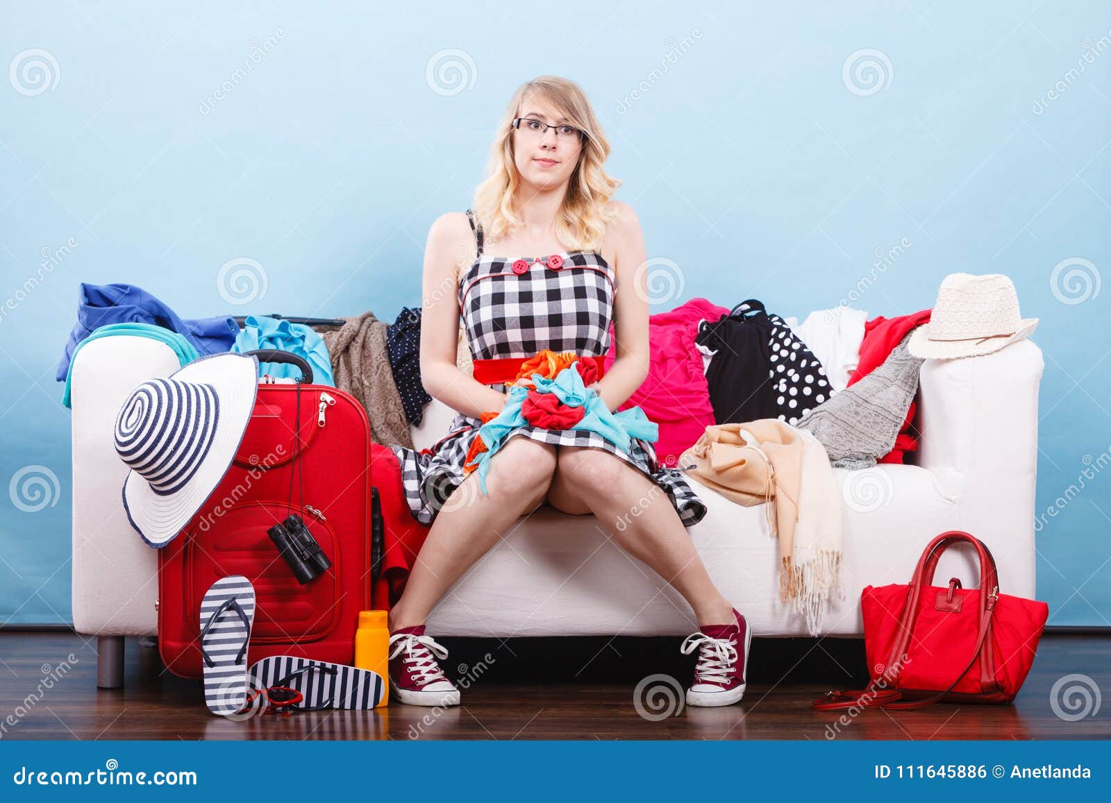 Woman Choosing Things To Pack into Suitcase Stock Photo - Image of ...