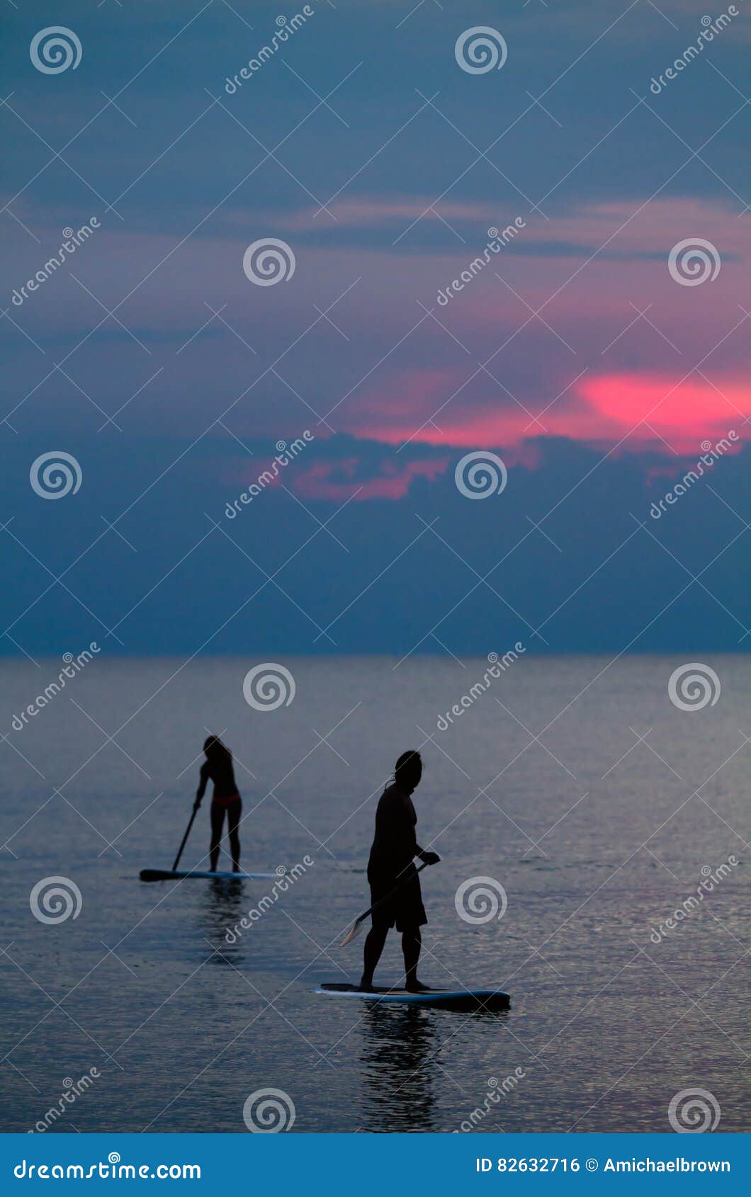 Paddleboarders / Paddle Boarding at Sunset Stock Photo - Image of ...