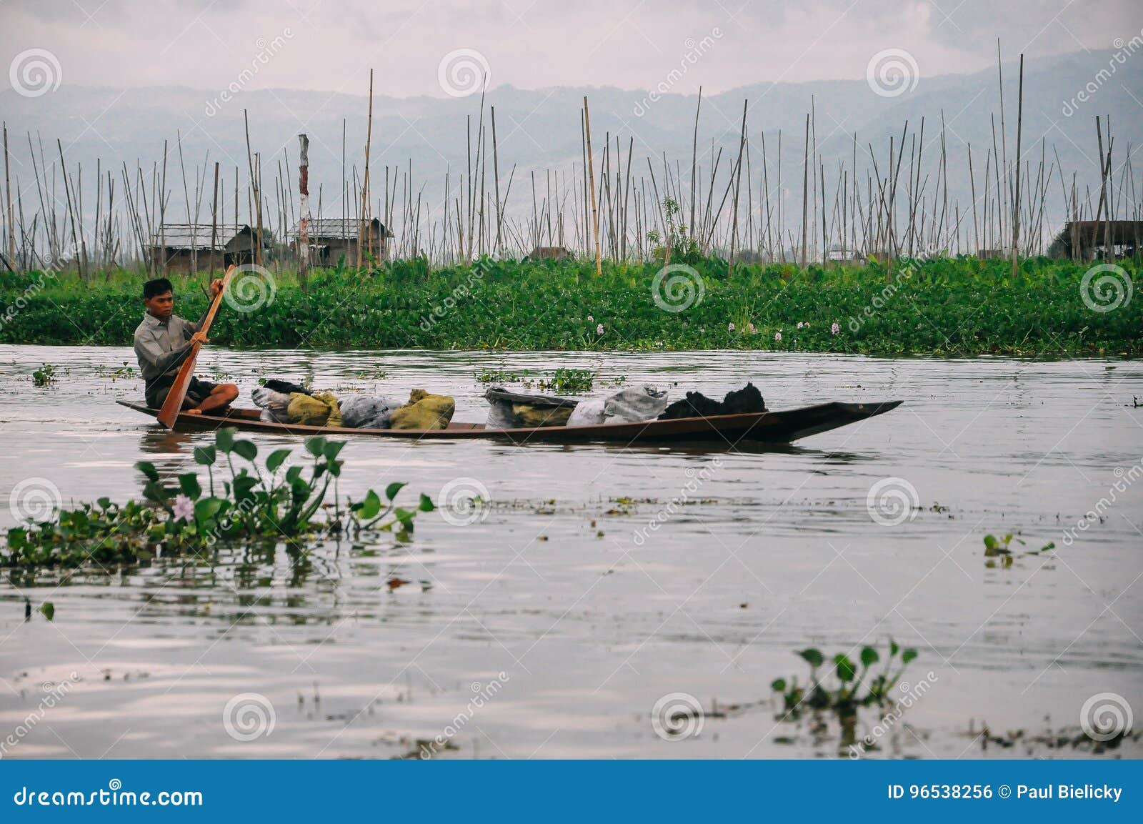 Paddling a Boat on Inle Lake. Editorial Photo - Image of housesand ...