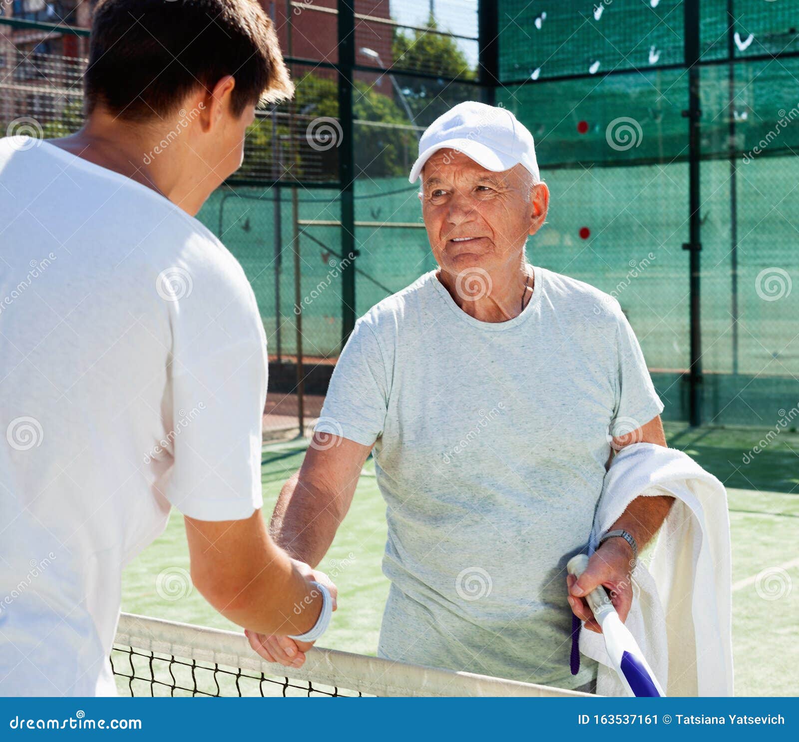Padel Players of Different Generations Shake Hands before Padel Match ...