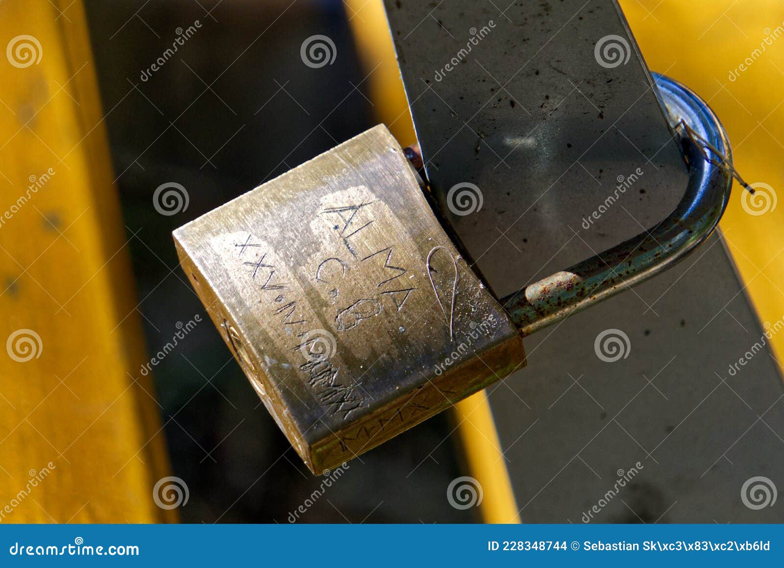 Padlock on a bench stock photo. Image of wood, hand - 228348744
