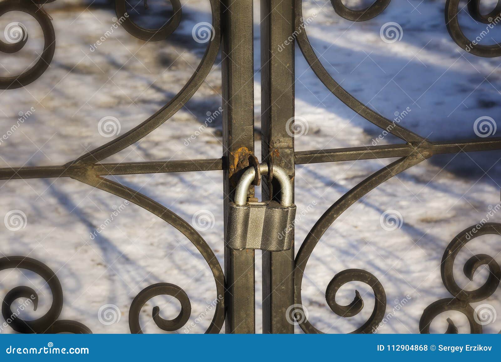 A Metal Decorative Gate Locked by a Padlock Stock Photo - Image of ...
