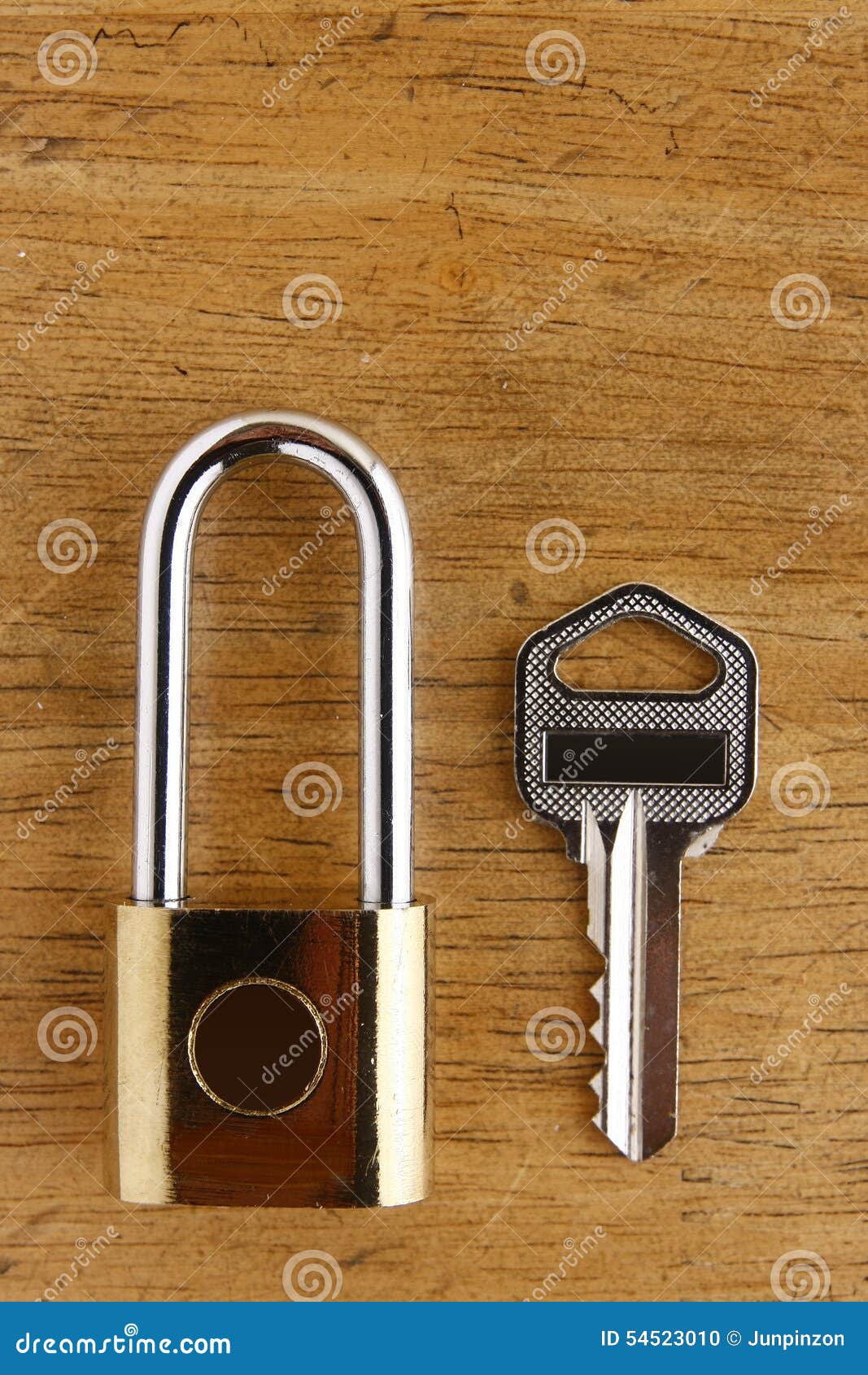 Padlock and a Key on a Wooden Table Stock Photo - Image of secure, iron ...