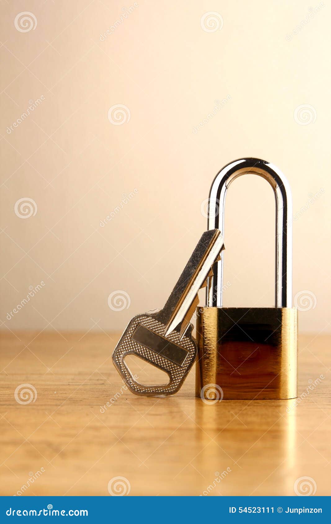 Padlock and a Key on a Wooden Table Stock Image - Image of lock, bronze ...