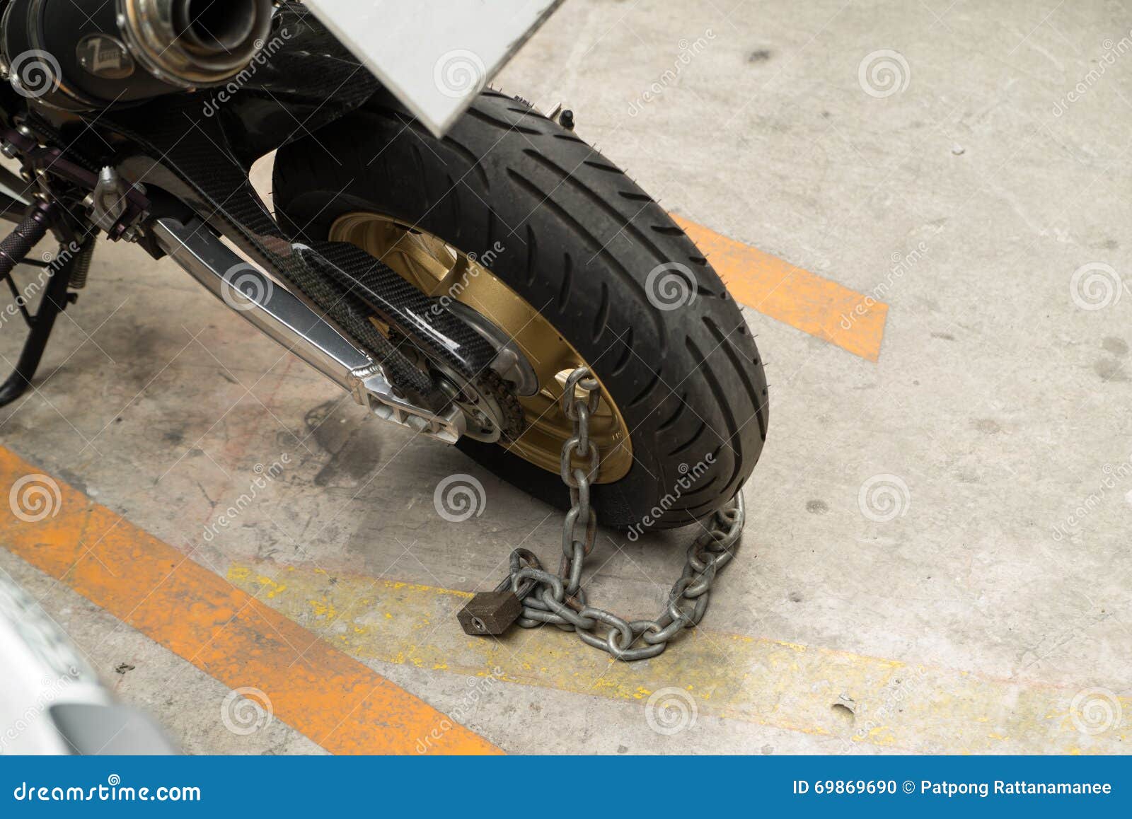 Padlock Security Lock Blocking the Motorcycle Wheel on Street Stock ...