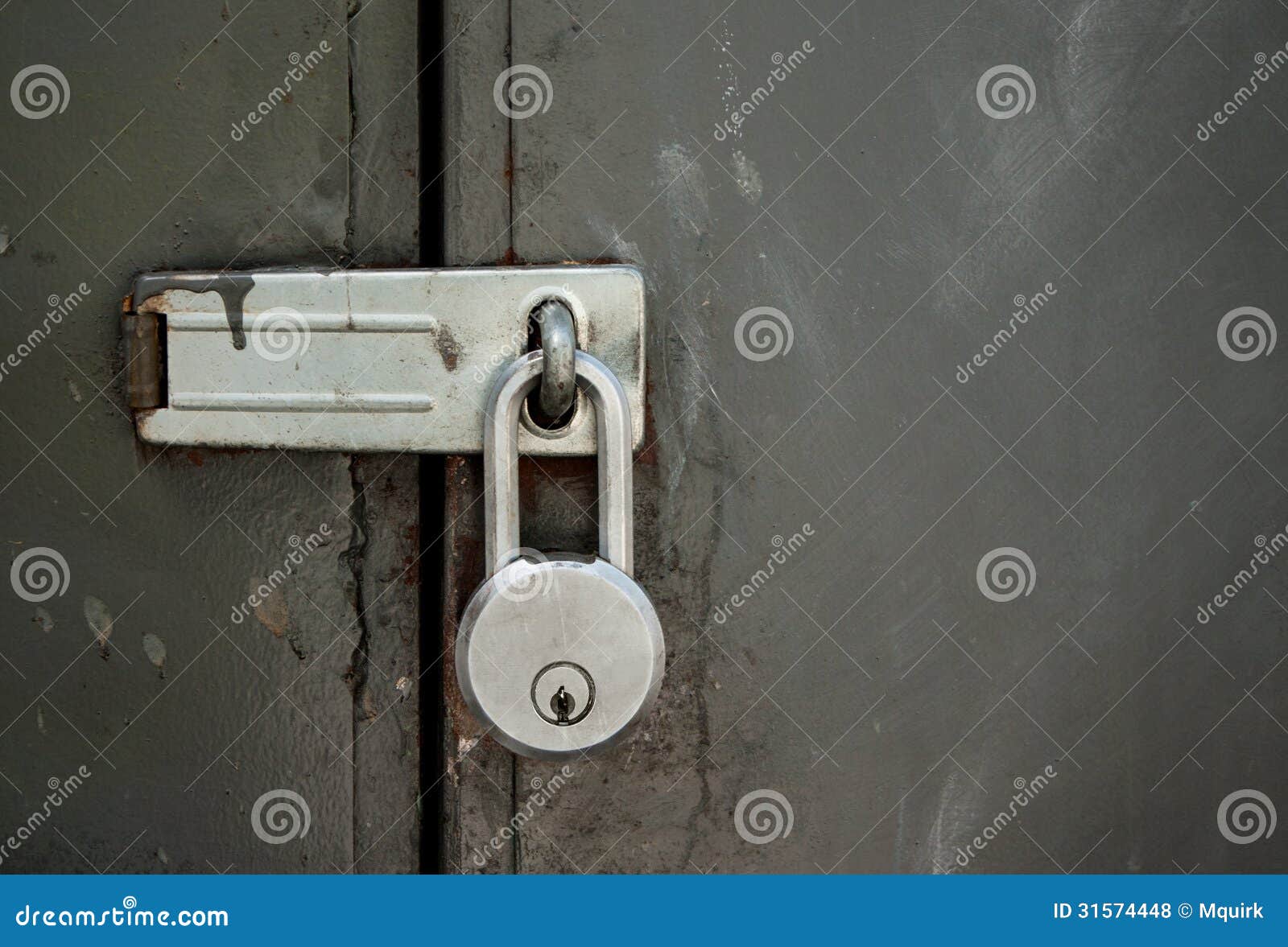 Padlock on a Steel Door stock photo. Image of locker - 31574448