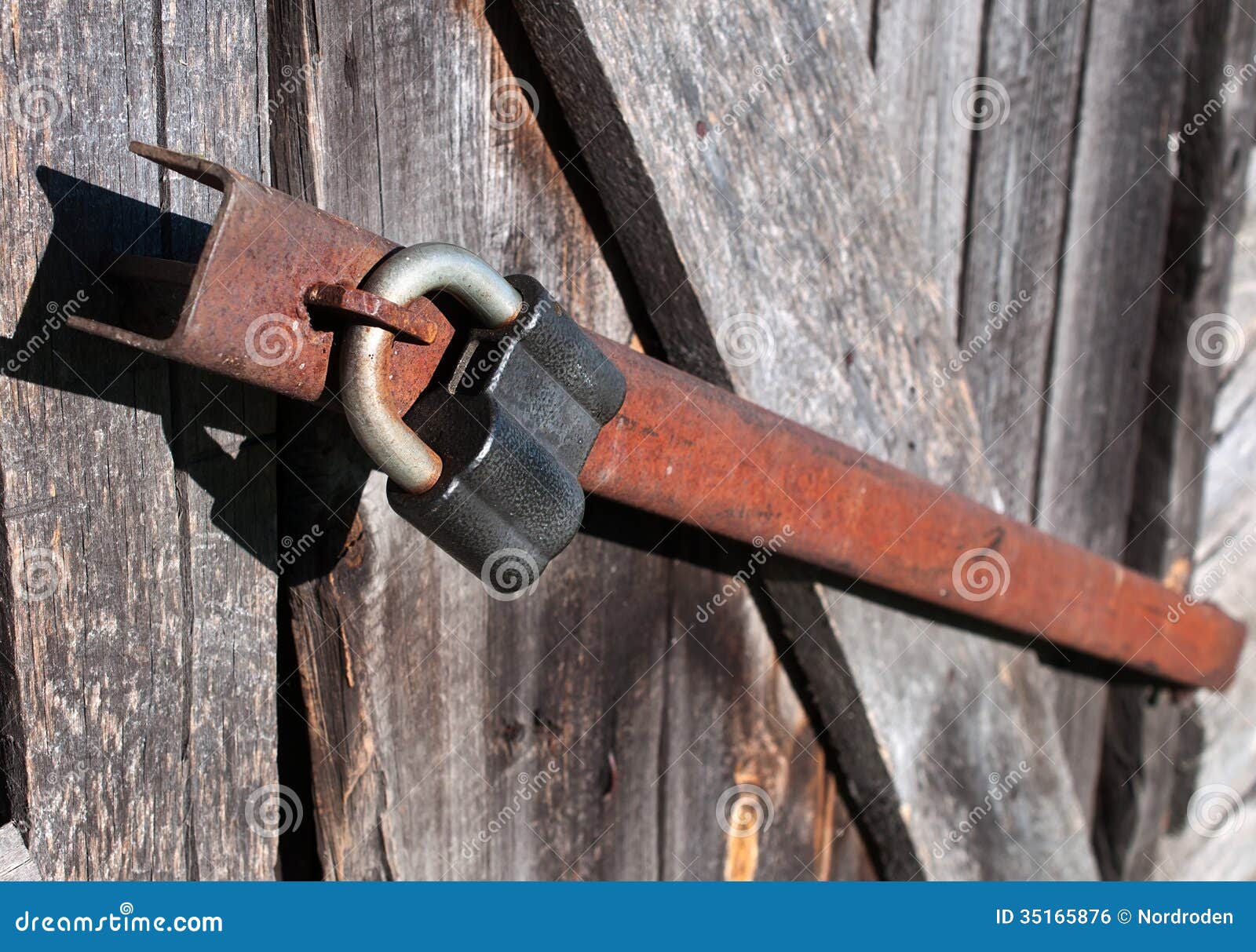 Padlock on wooden door. stock photo. Image of grunge - 35165876