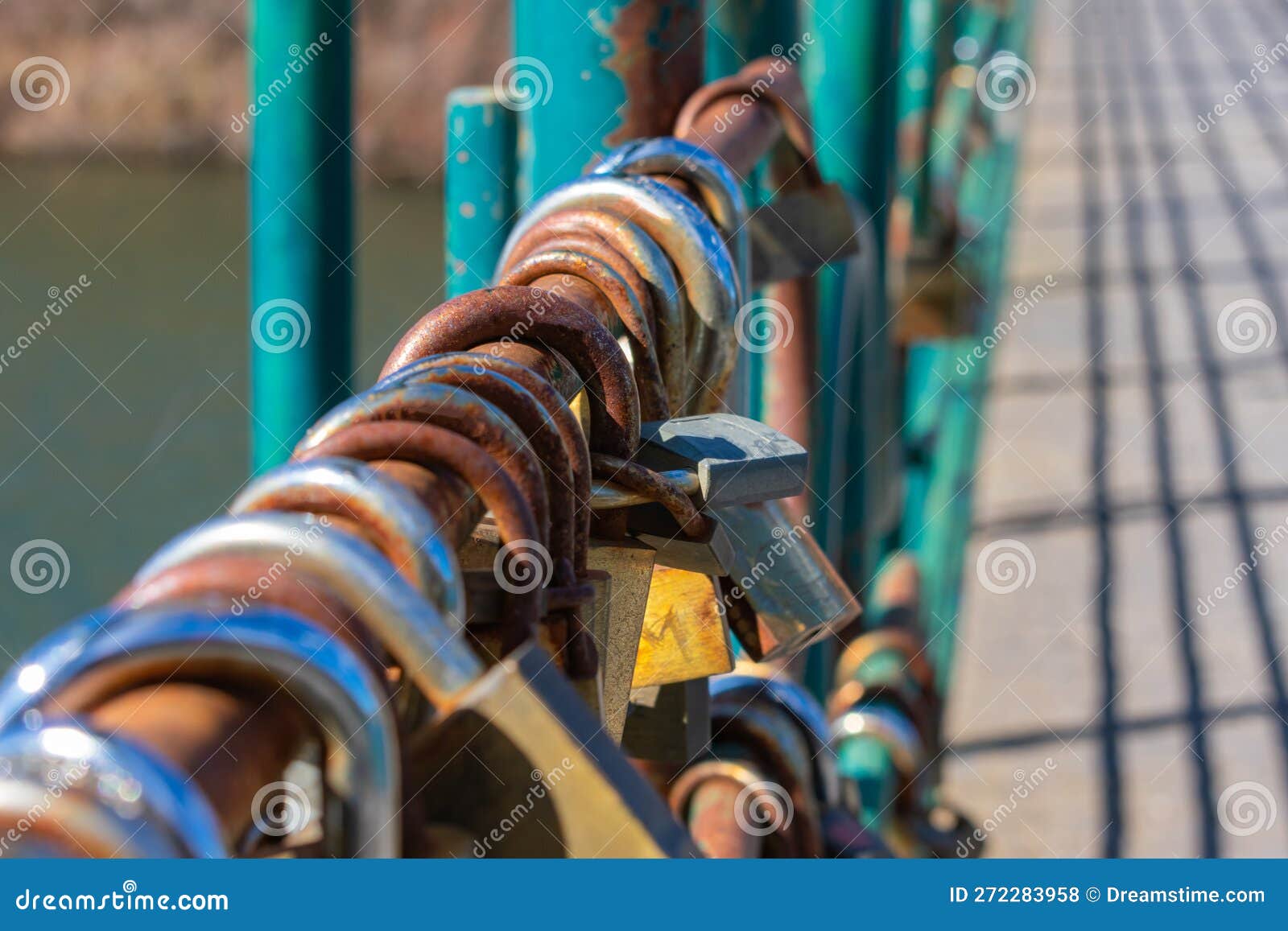 Padlocks on the Metal Railing of the Bridge Over the River Stock Photo ...
