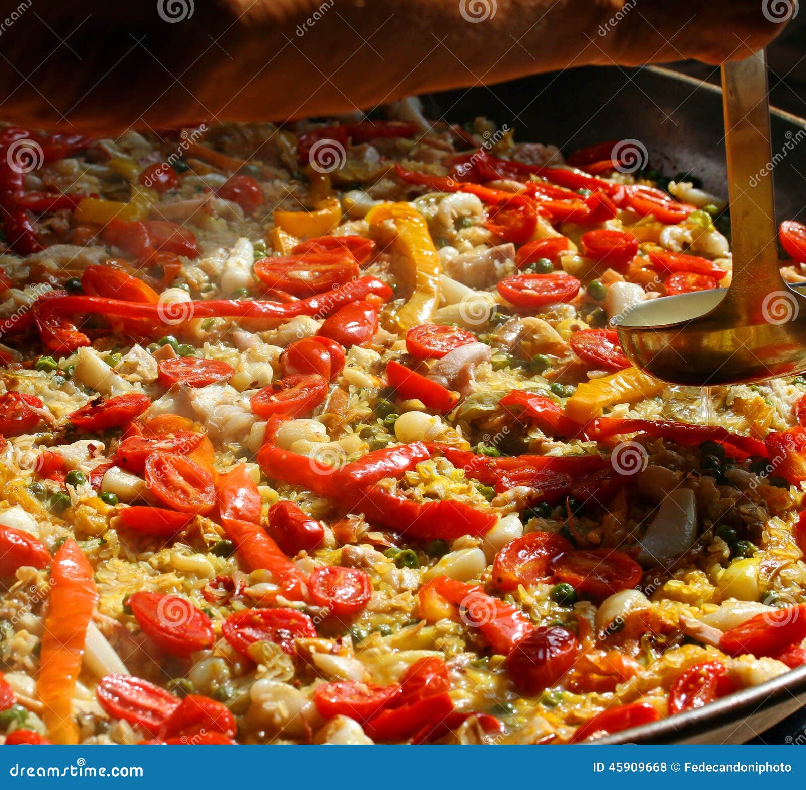 Paella with Chef s spoon stock photo. Image of dish, food - 45909668