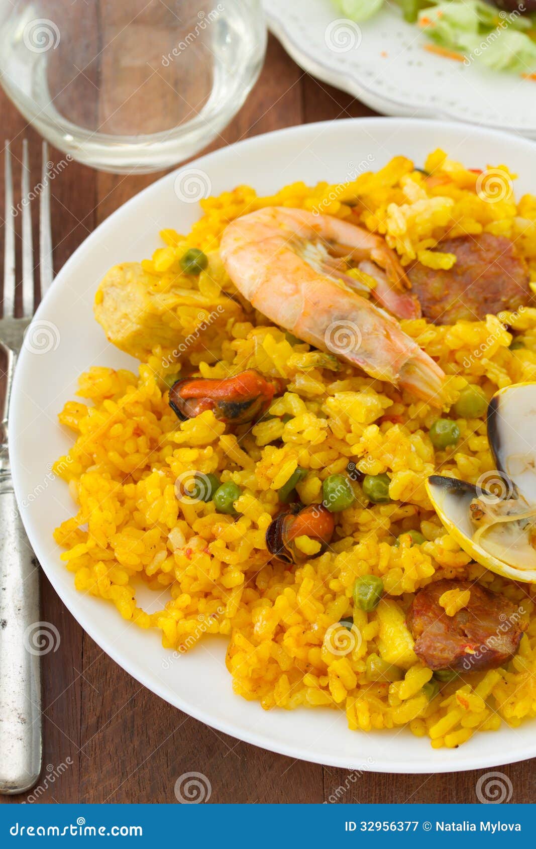 Paella on white plate stock image. Image of kunch, paella - 32956377
