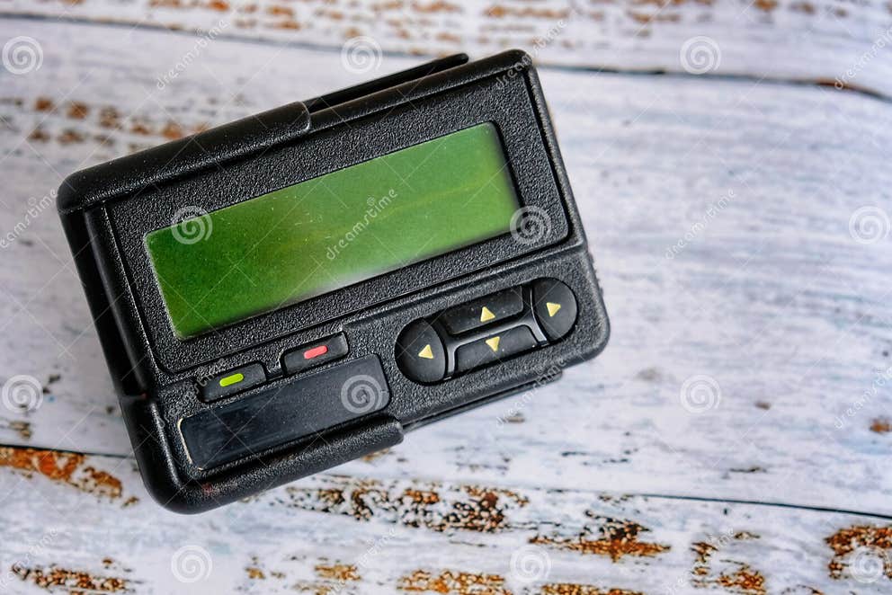 Pager or Beeper on Light Wood Background Stock Photo - Image of device ...