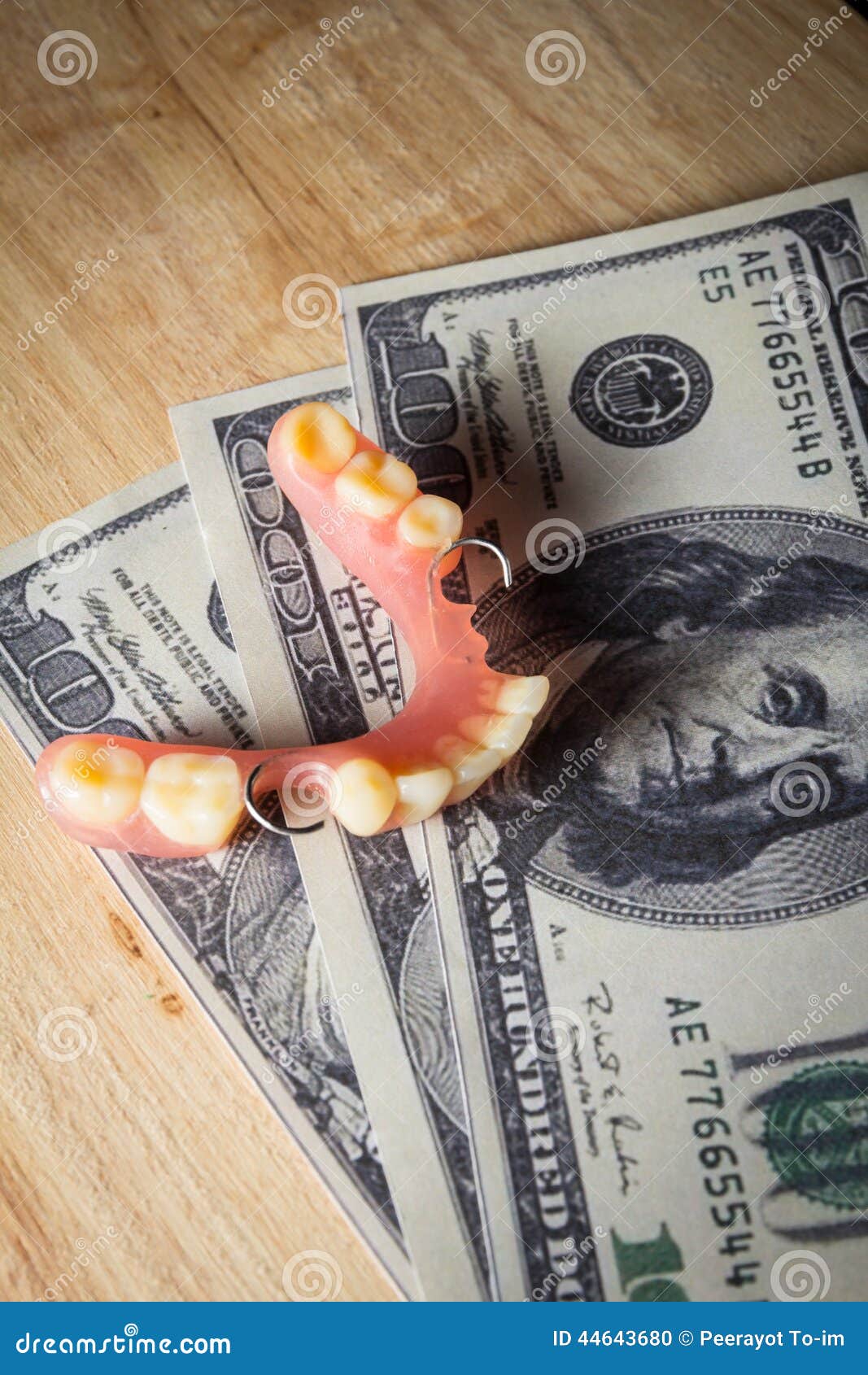 Paid Money for Teeth Care,artificial with Dollar Note. Stock Photo ...