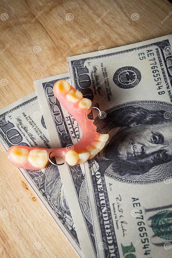Paid Money for Teeth Care,artificial with Dollar Note. Stock Photo ...