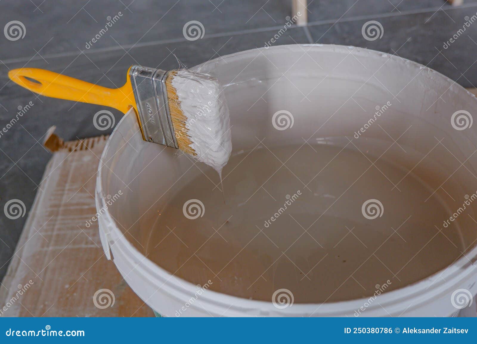 The Paint Brush is Fixed in a Bucket Above the Paint.construction Works ...