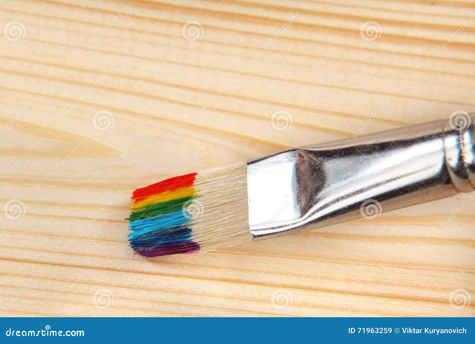 Paint Brush with Rainbow Strokes on Bristle on Wooden Background Stock ...
