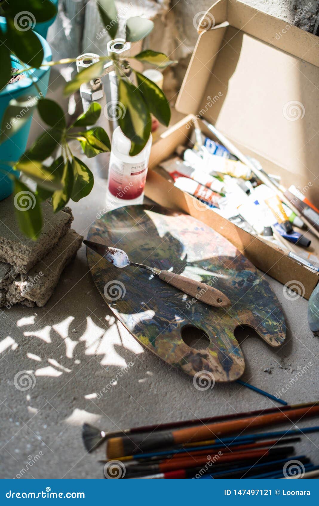 Paint Brushes and Assorted Paints on the Floor of Artist`s Studio Stock ...