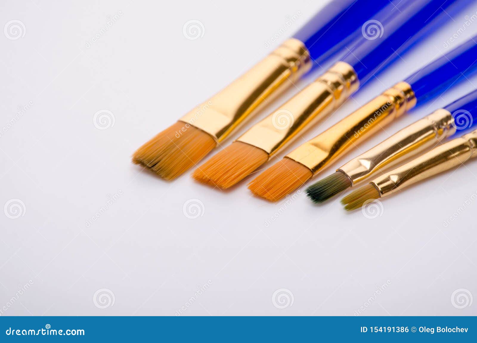 Paint Brushes with Blue Handle of Different Sizes on White Background ...