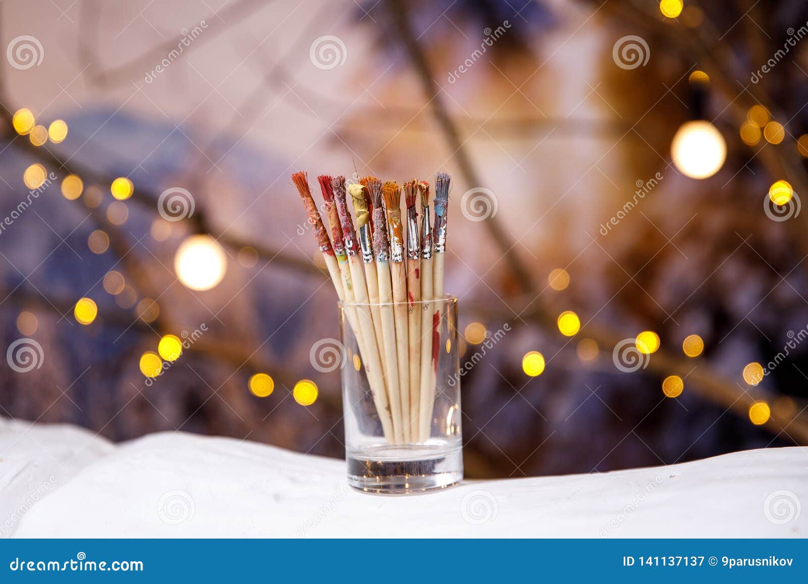 Paint Brushes in a Glass Jar with Remnants of Paint. Stock Image ...