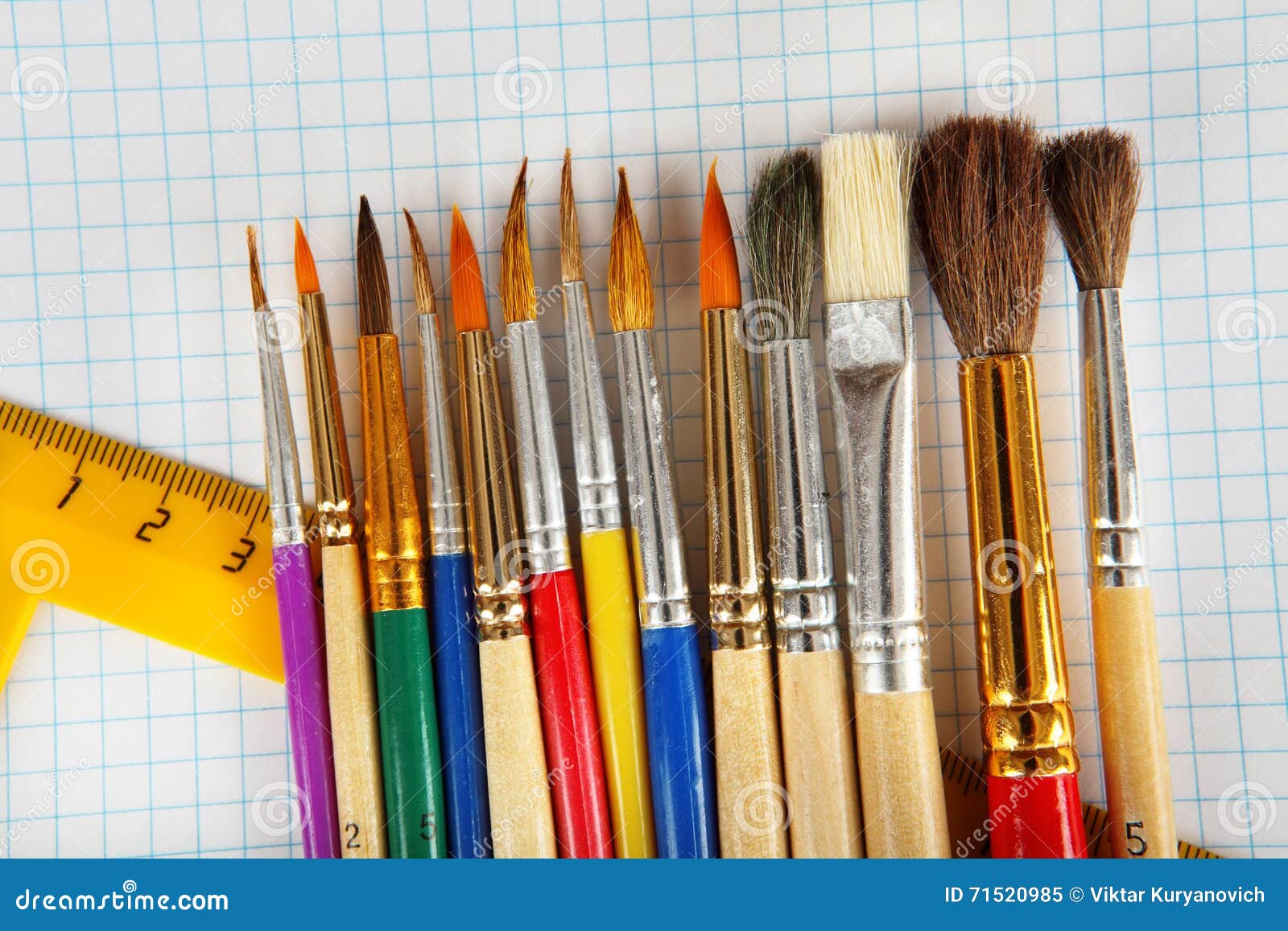 Paint Brushes and Ruler on Checkered Paper Background Stock Image ...
