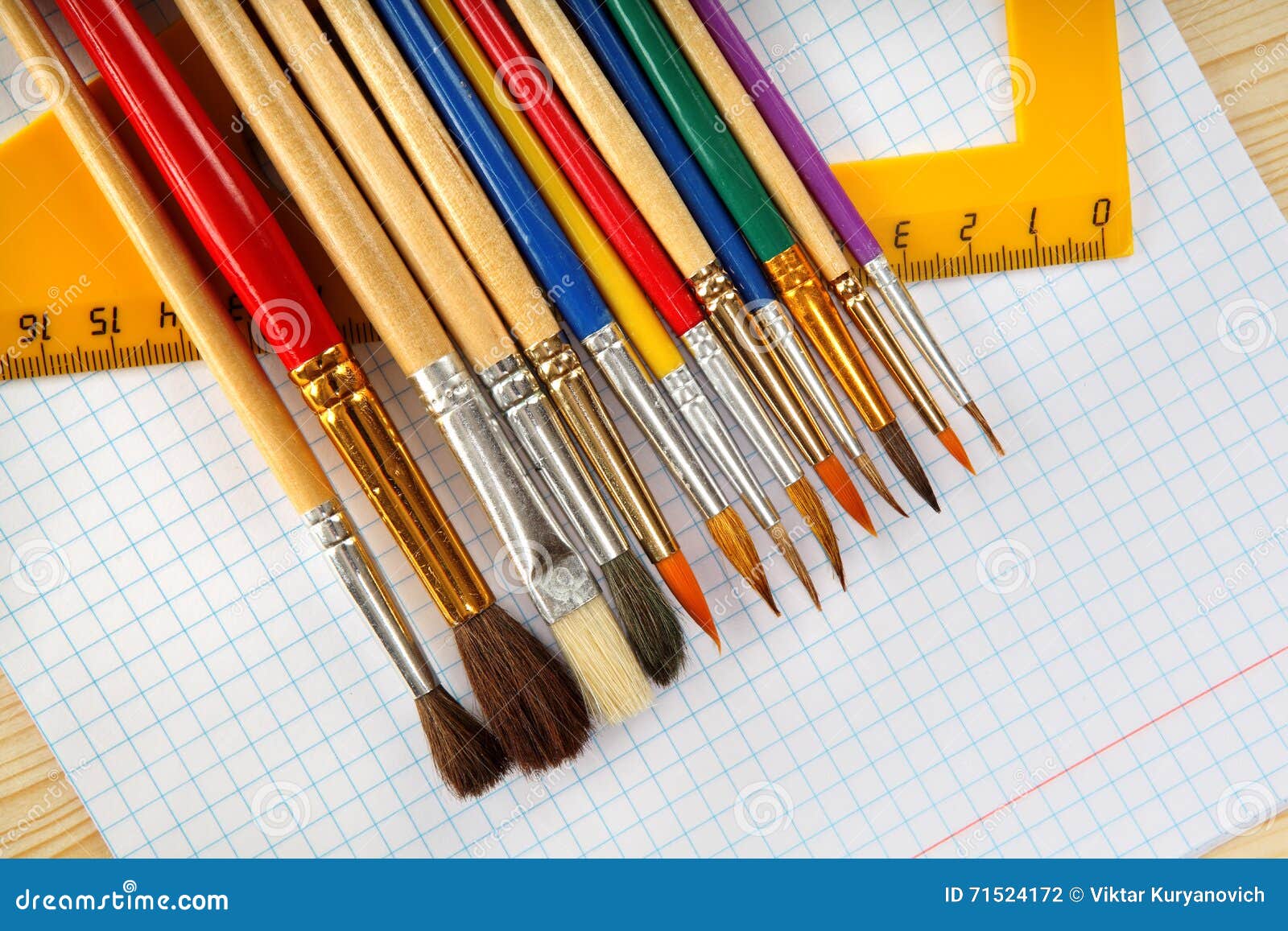 Paint Brushes, Ruler and Checkered Paper on Wooden Background Stock ...