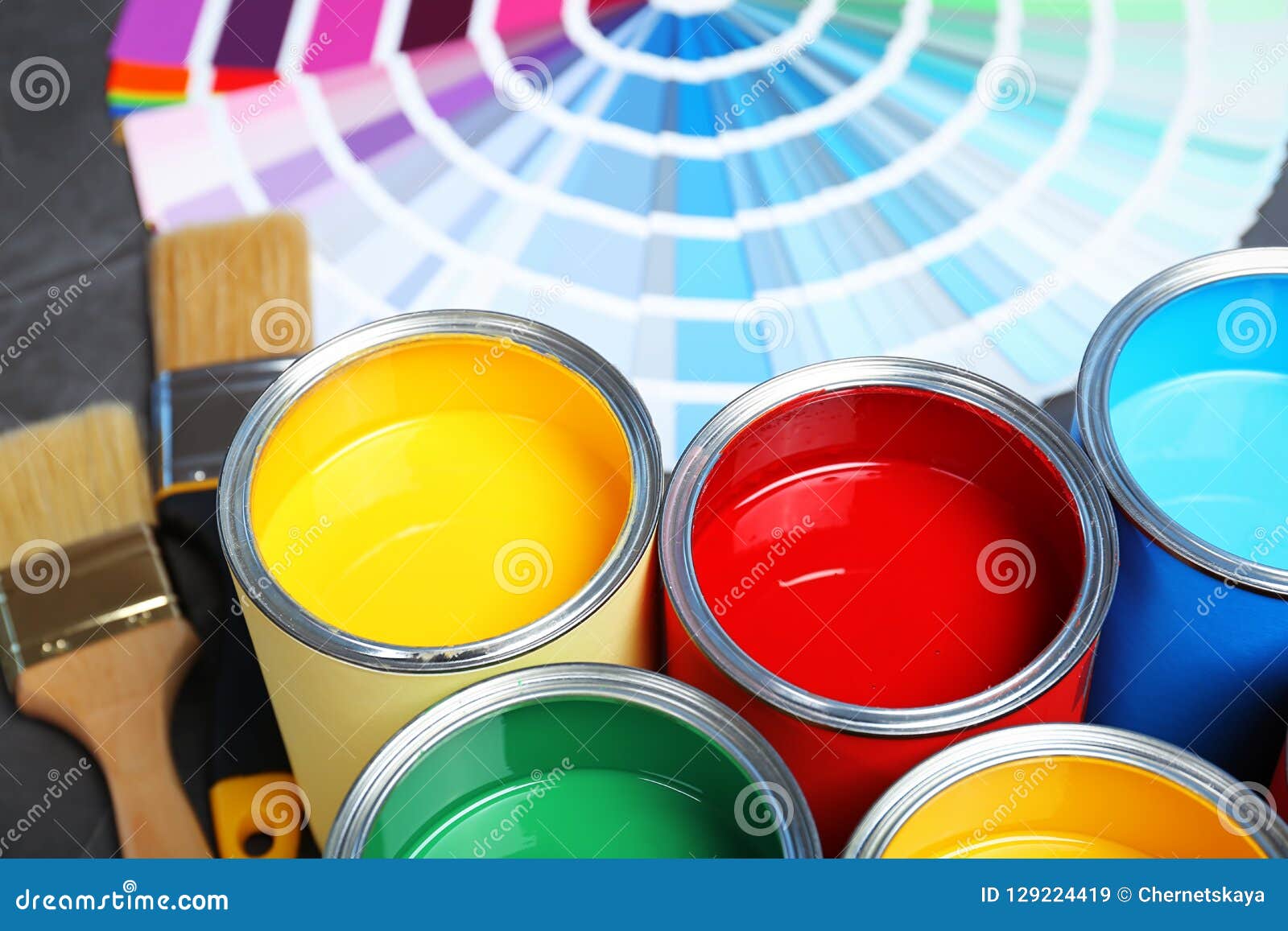 Paint Cans and Color Palette Samples on Table Stock Image - Image of ...