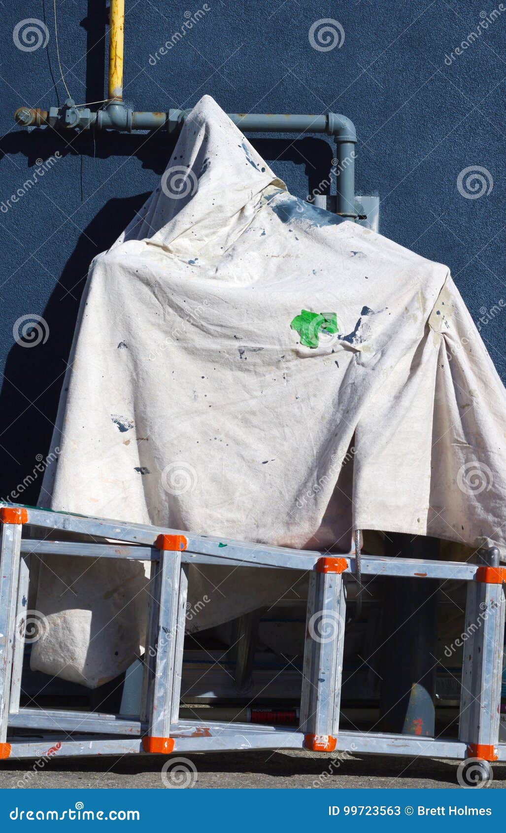 Paint Drop Cloth and Blue Wall Stock Image - Image of brush, blanket ...