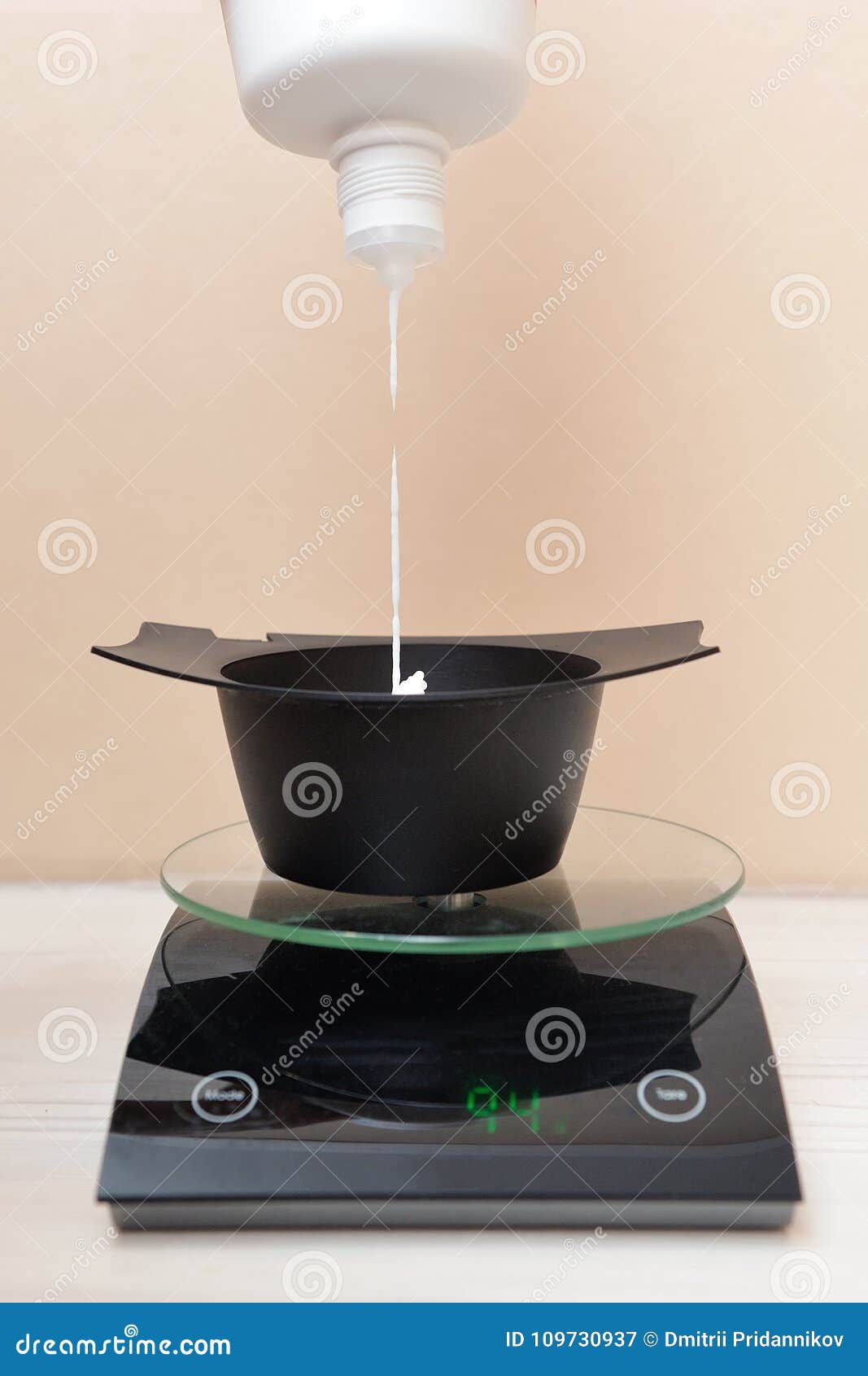 The Paint for Dyeing the Hair is Squeezed into the Container Stock ...