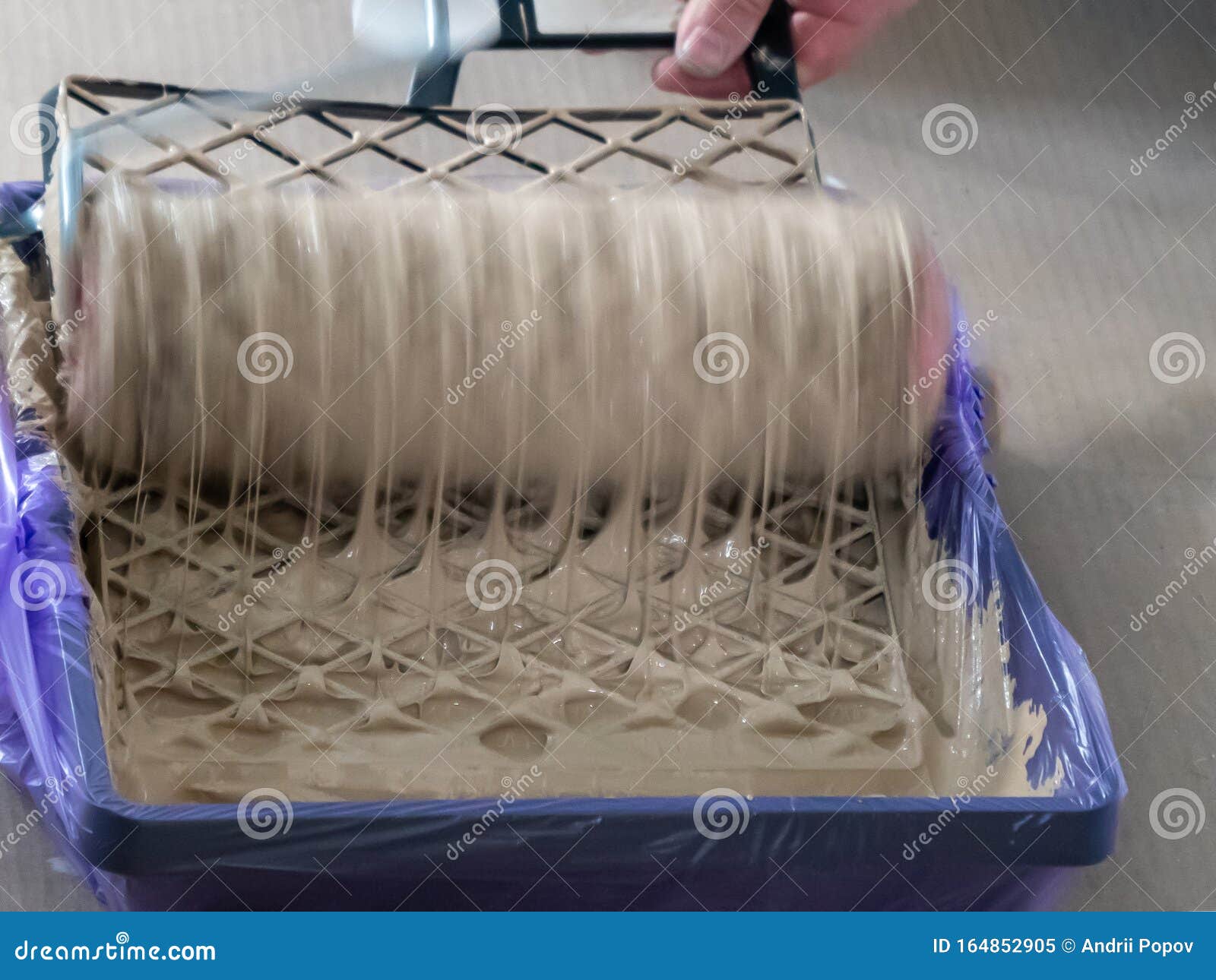 Paint Roller in a Bucket with Paint for a House Painter Stock Image ...