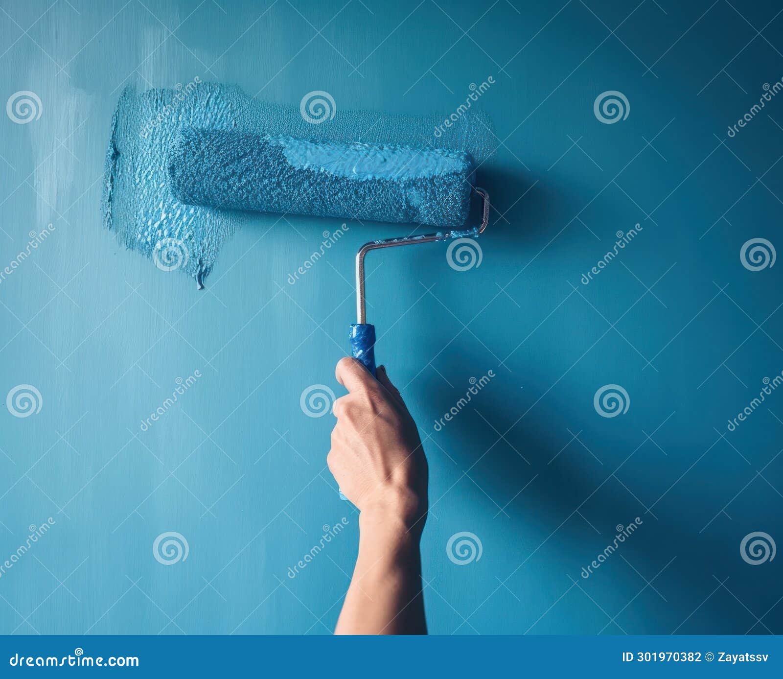 Paint Roller on the Wall during Painting - Renovation of the Building ...