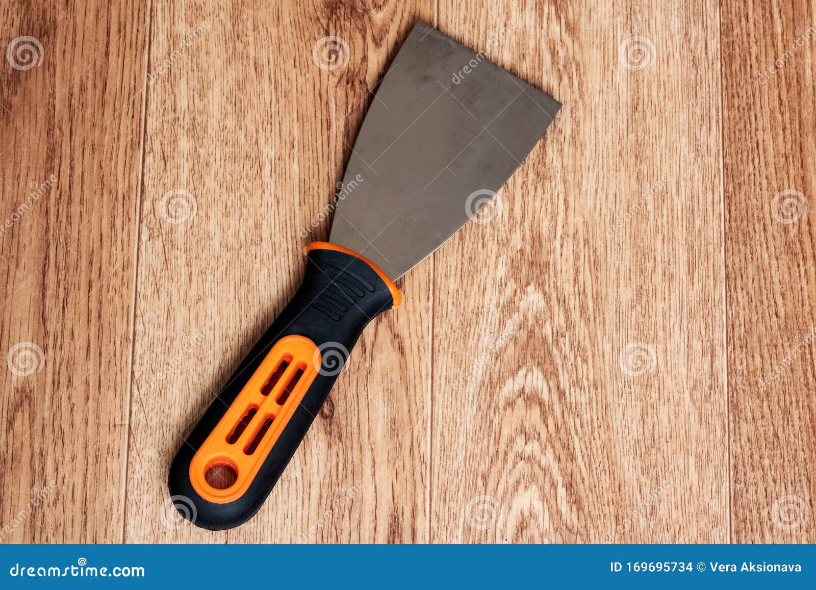 Paint Spatula with Black Handle on Wooden Background Stock Photo ...