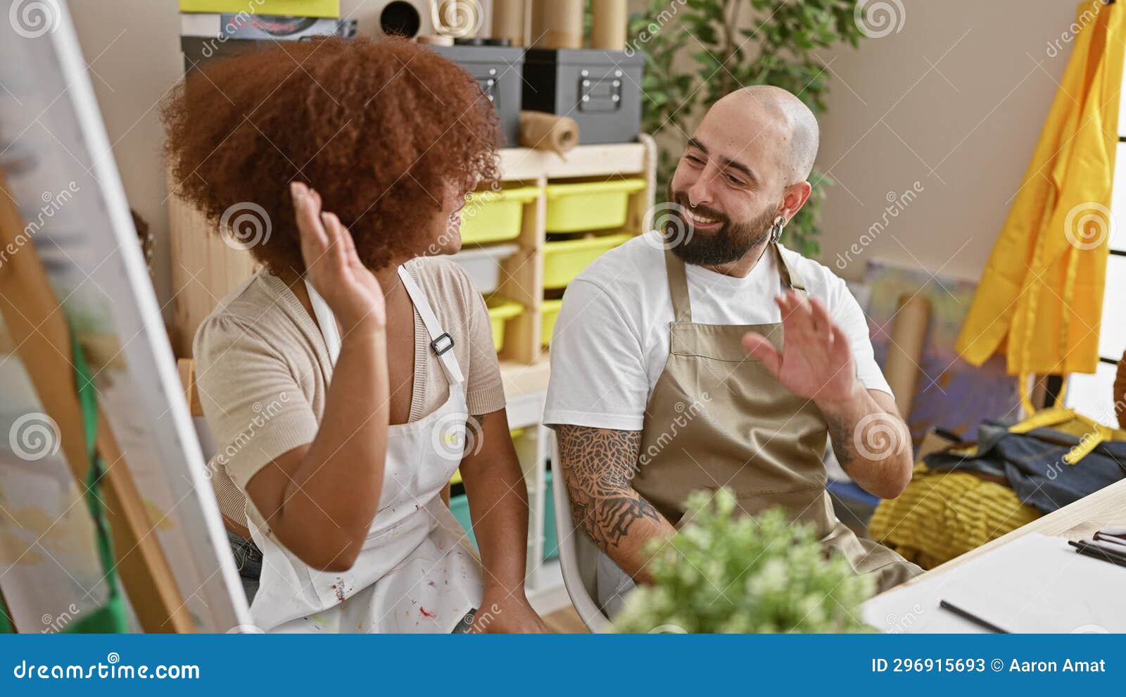 In a Paint-splattered Studio, Two Beaming Artists Share a High Five ...