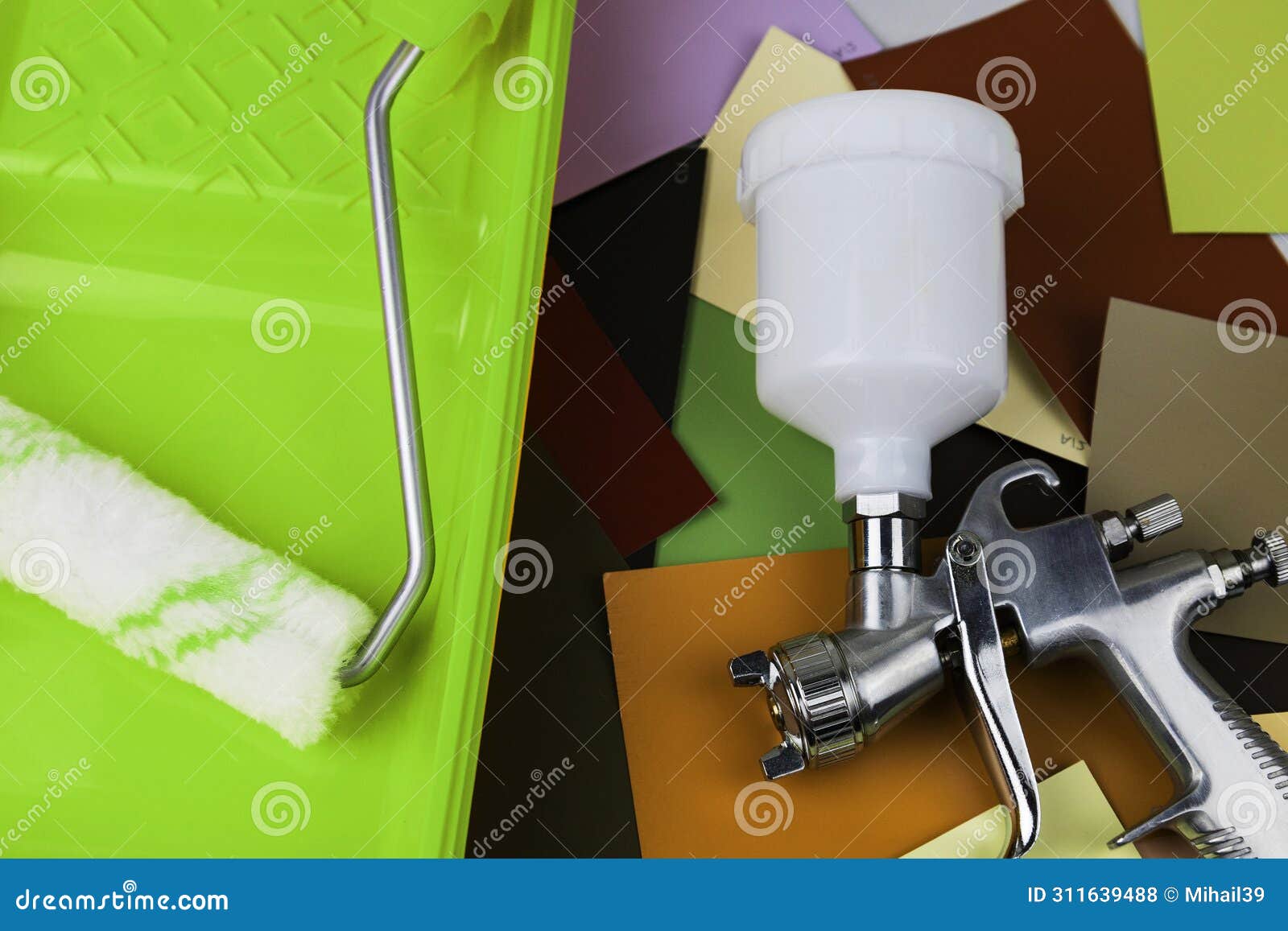 Paint Spray Gun at Work at the Workplace in the Workshop. Paint Brush ...