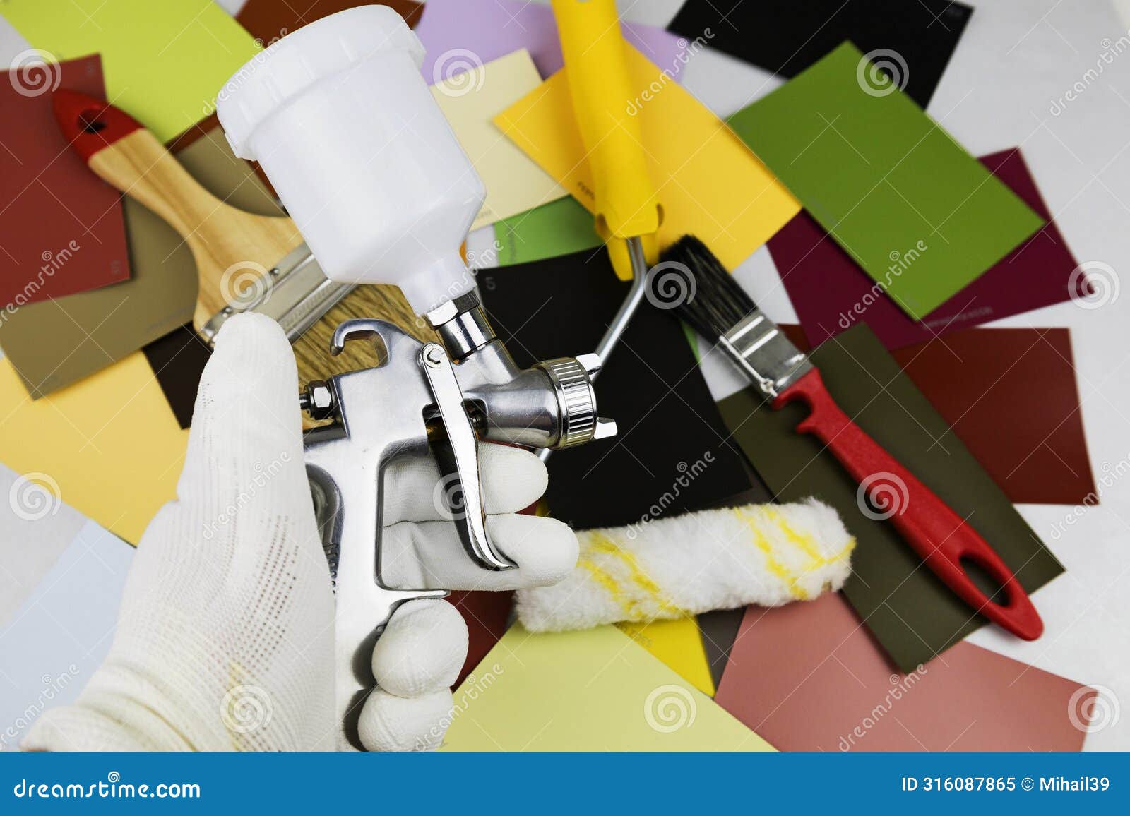 Paint Spray Gun at Work at the Workplace in the Workshop. Paint Brush ...